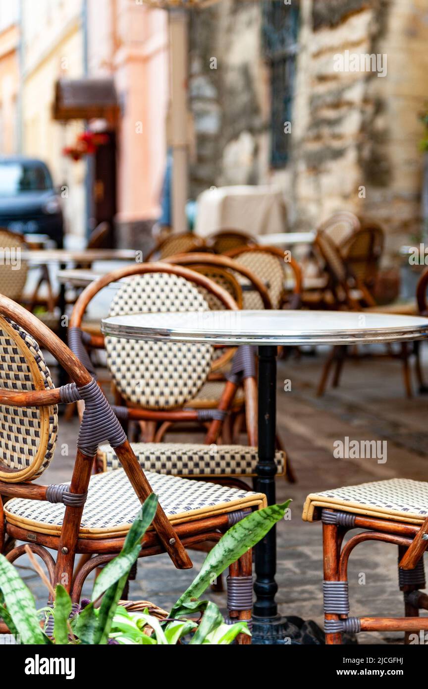Outdoor cafe in the old town. Chairs and table on empty terrace at cafe ...