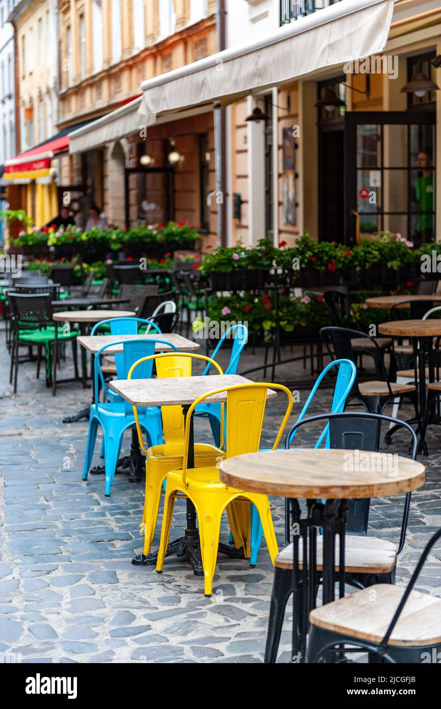 Outdoor cafe in the old town. Chairs and table on empty terrace at cafe ...
