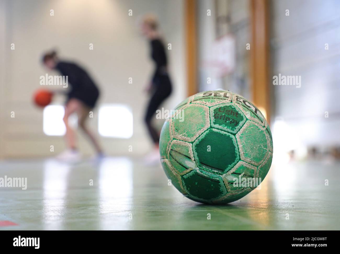 Students from a school during a sports lesson in a sports hall. Here is ...