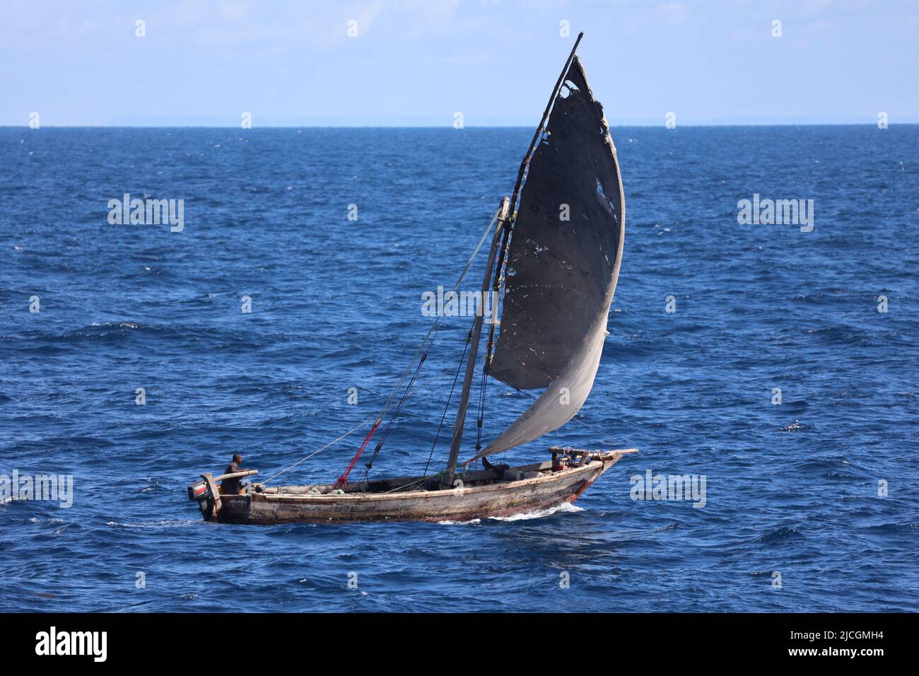 Fisherman on a traditional wooden Dhow boat, Indian Ocean, Zanzibar ...