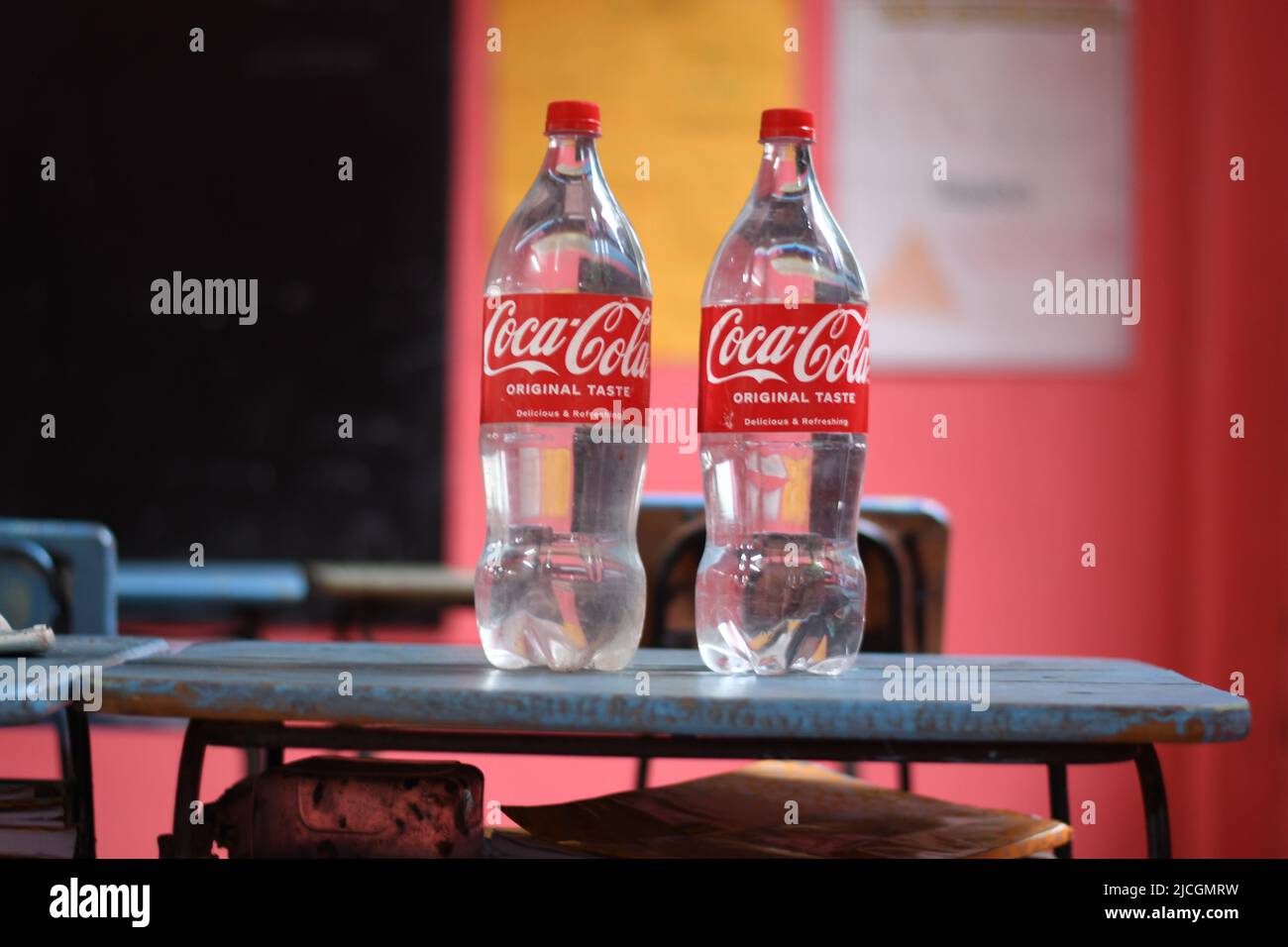 Two white coca cola bottles on the table. Most popular drink in the ...