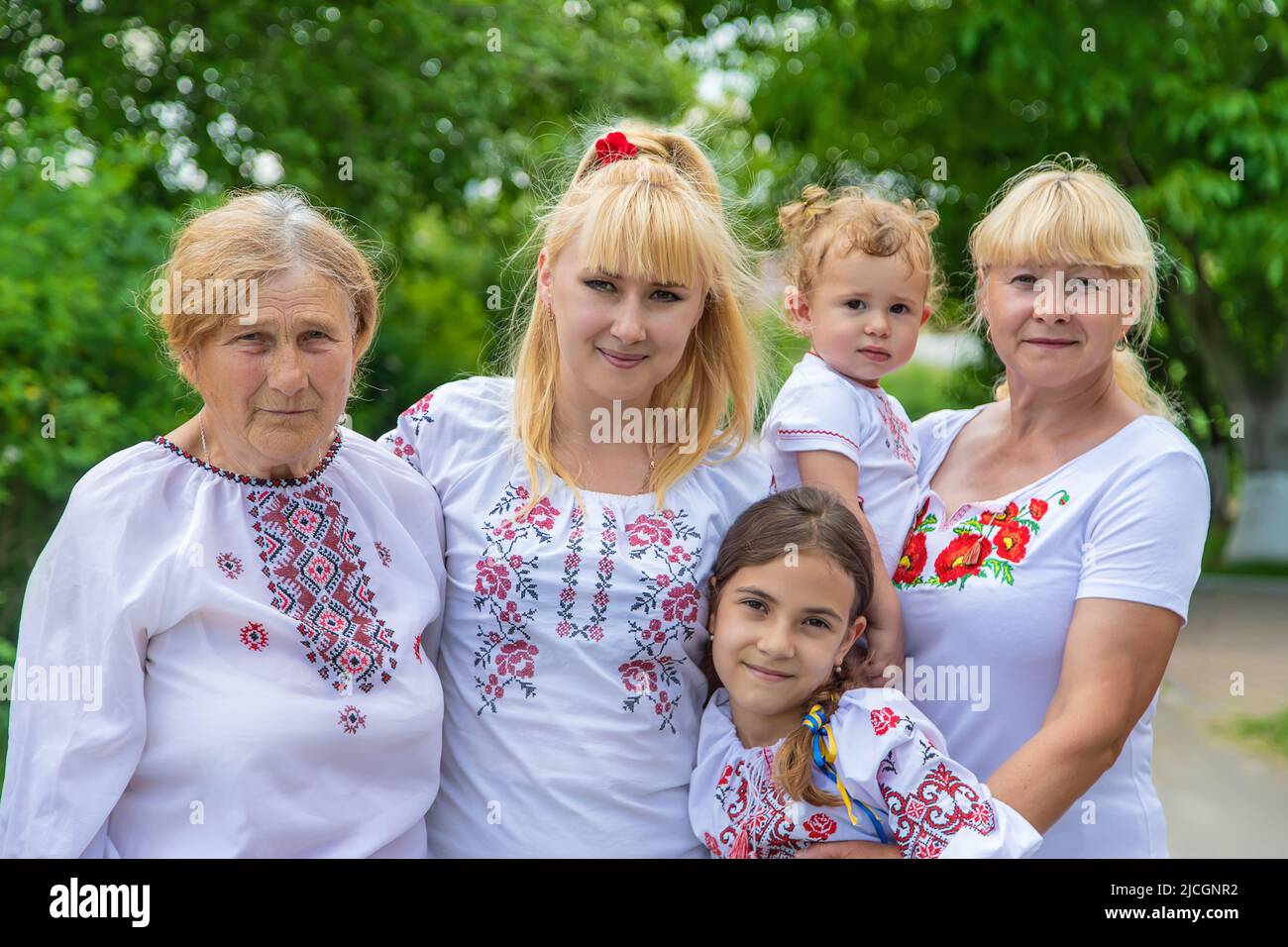 Family photo of a Ukrainian woman in embroidered shirts. Selective ...