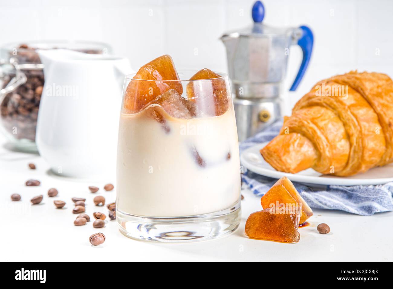 Cold coffee cocktail with frozen coffee espresso ice cubes and milk ...