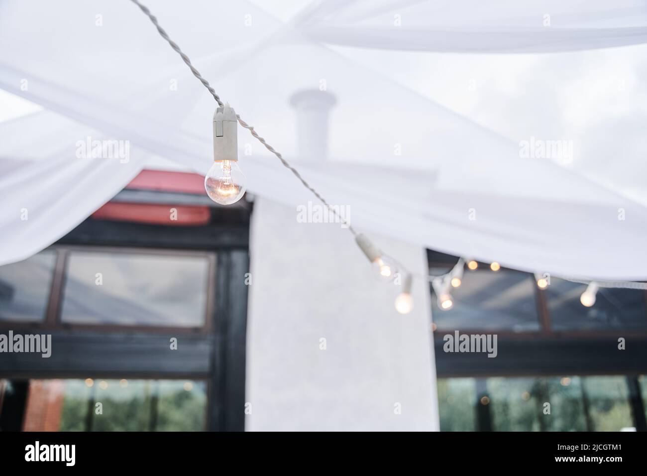 Light bulb decor in an outdoor party Stock Photo - Alamy