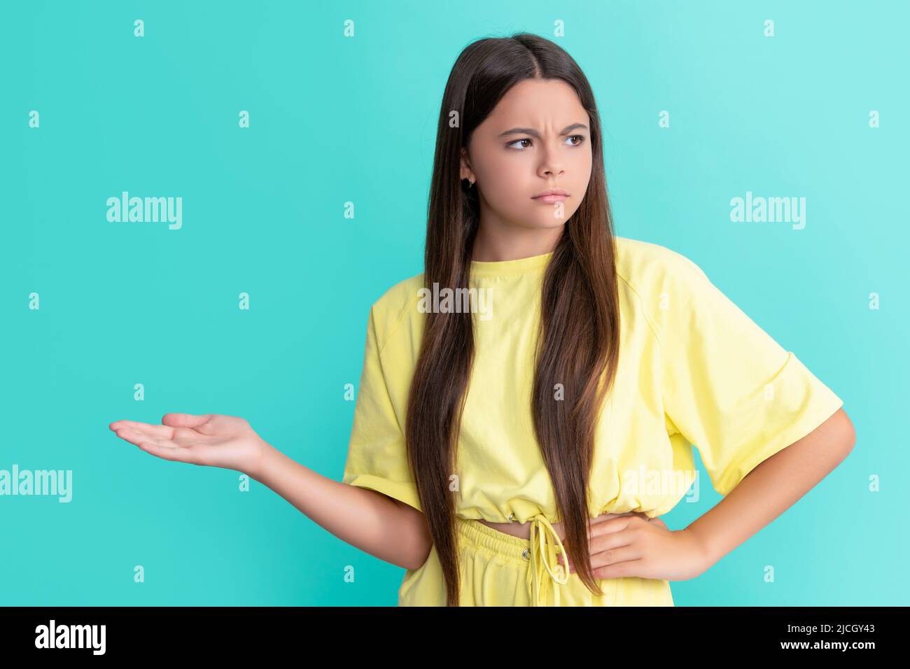face portrait of child on blue background. express emotions. serious ...