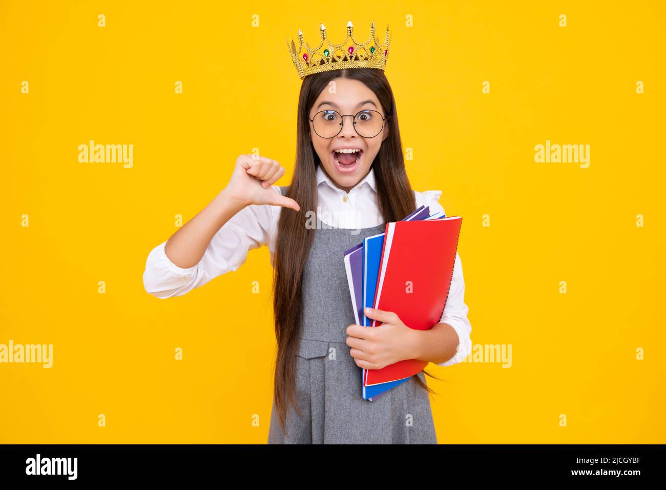 Excited teenager princess in school uniform and crown celebrating ...