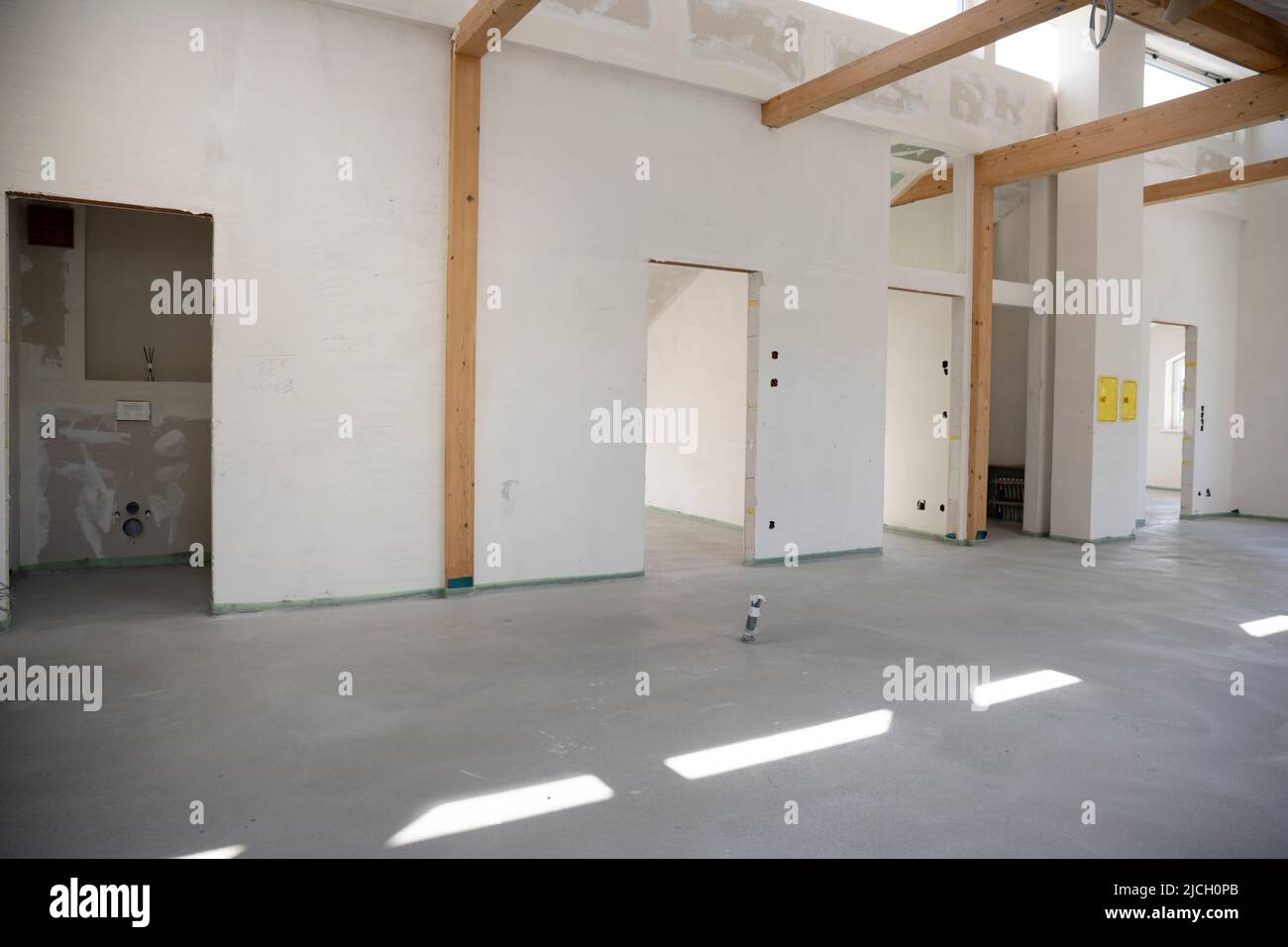 freshly cured concrete screed on construction site in loft in a family ...