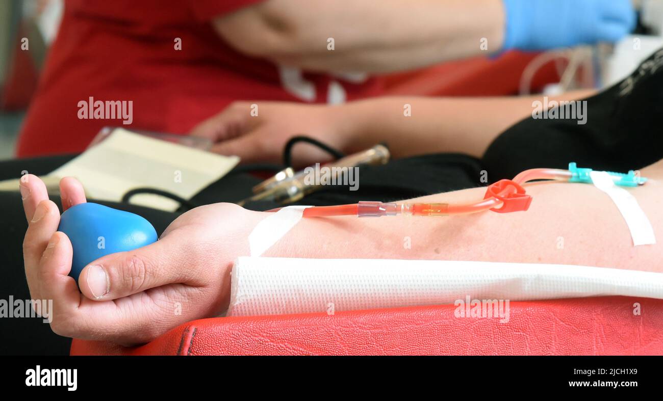 Leipzig, Germany. 09th June, 2022. An arm lies on the back of a chair ...