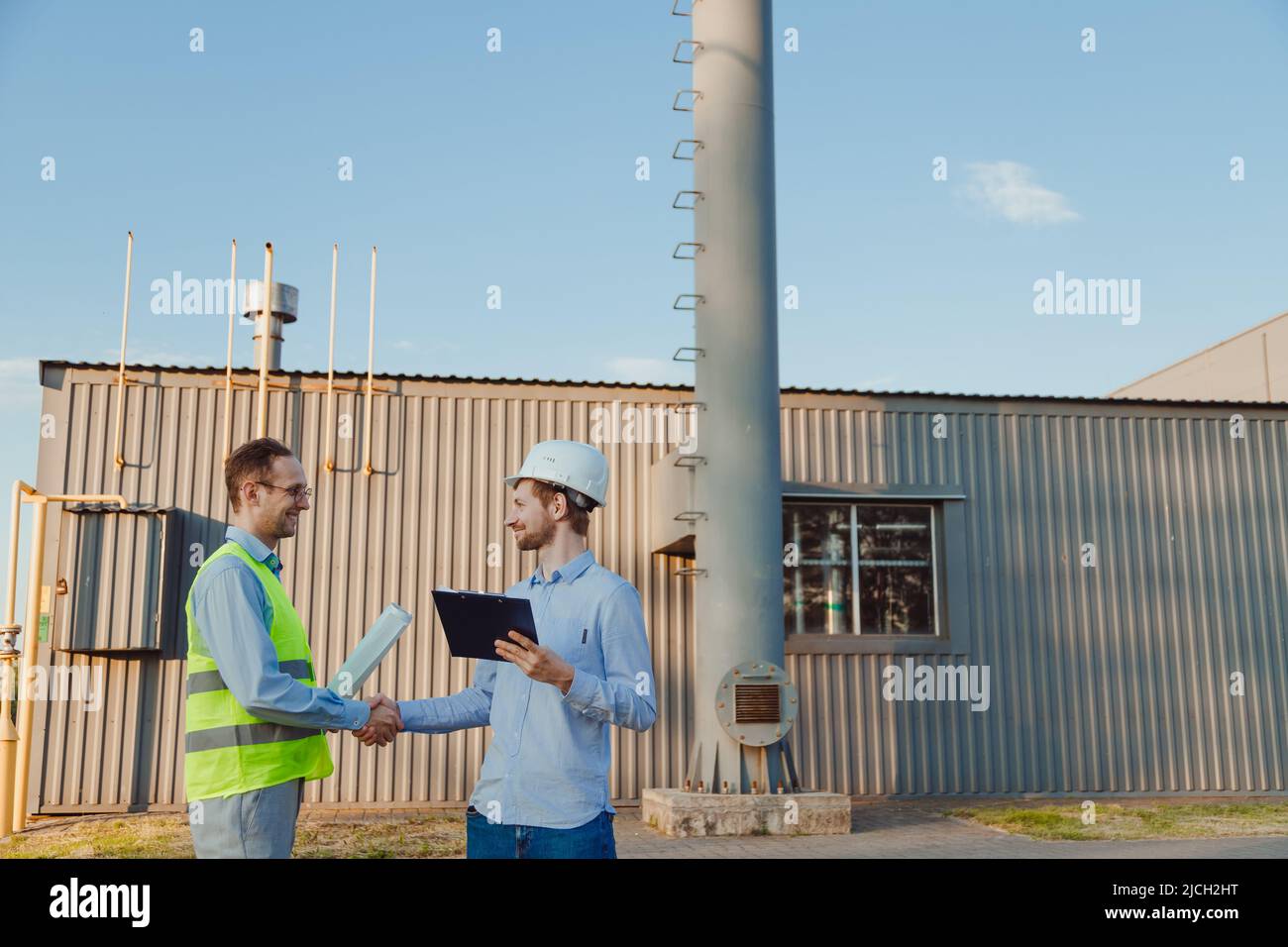 The customer greets civil engineer with a handshake at mini thermal ...