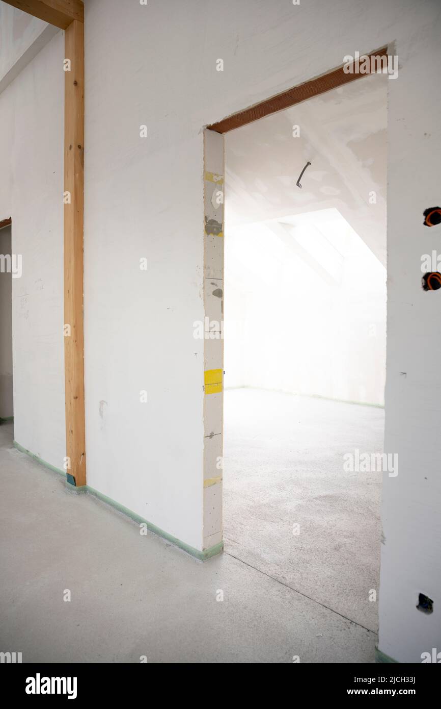 freshly cured concrete screed on construction site in loft in a family ...