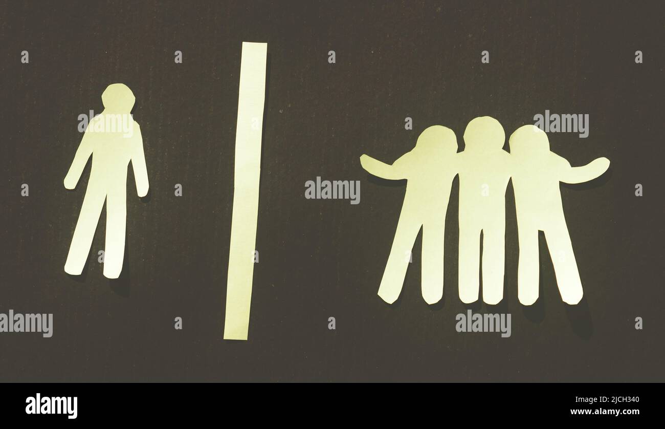 Paper man standing Isolated from group. Feel Left out and alone. Social ...