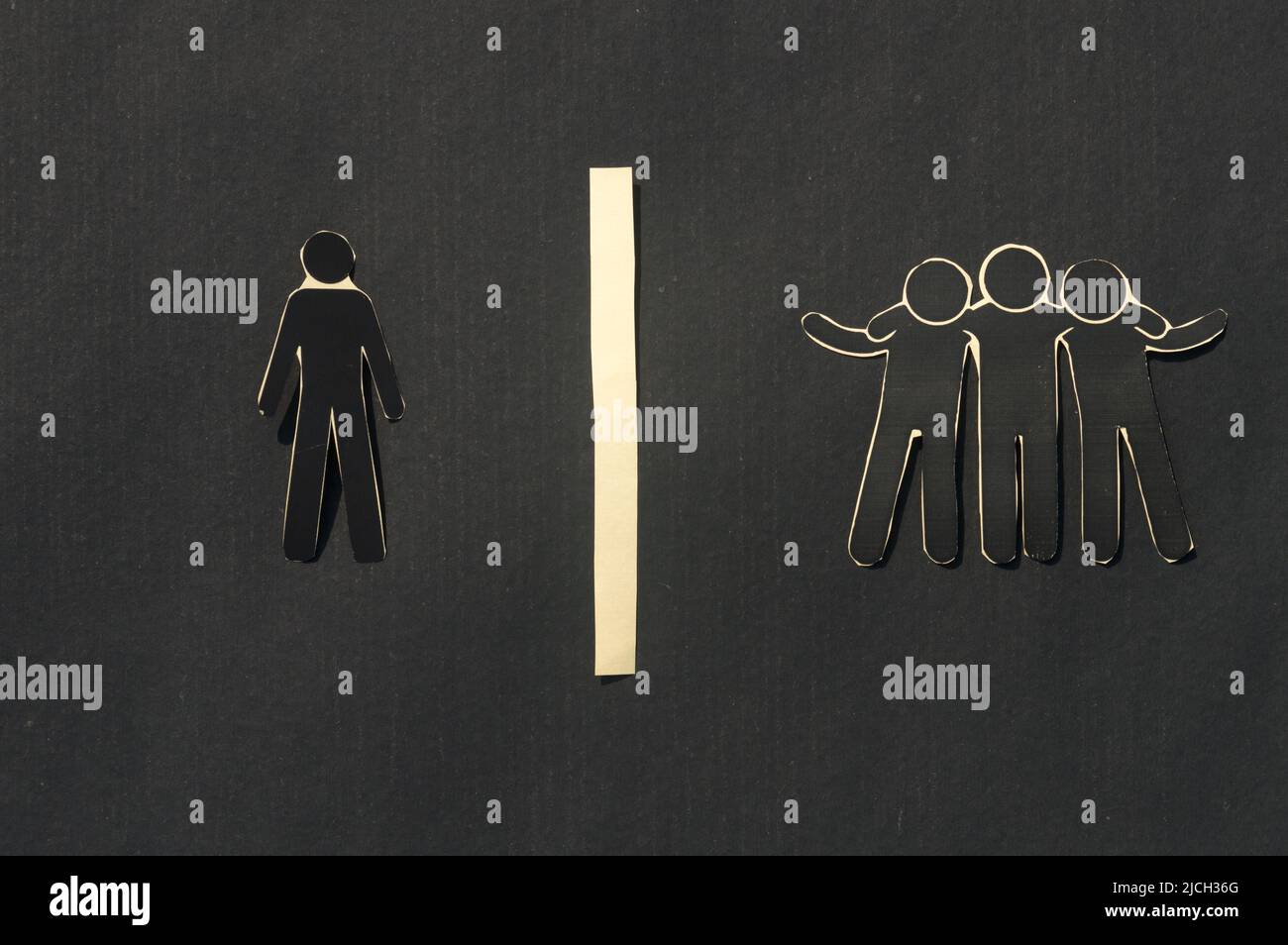 Paper man standing Isolated from group. Feel Left out and alone. Social ...