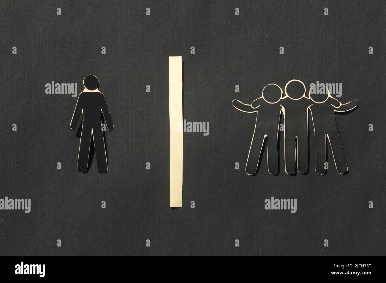 Paper man standing Isolated from group. Feel Left out and alone. Social ...