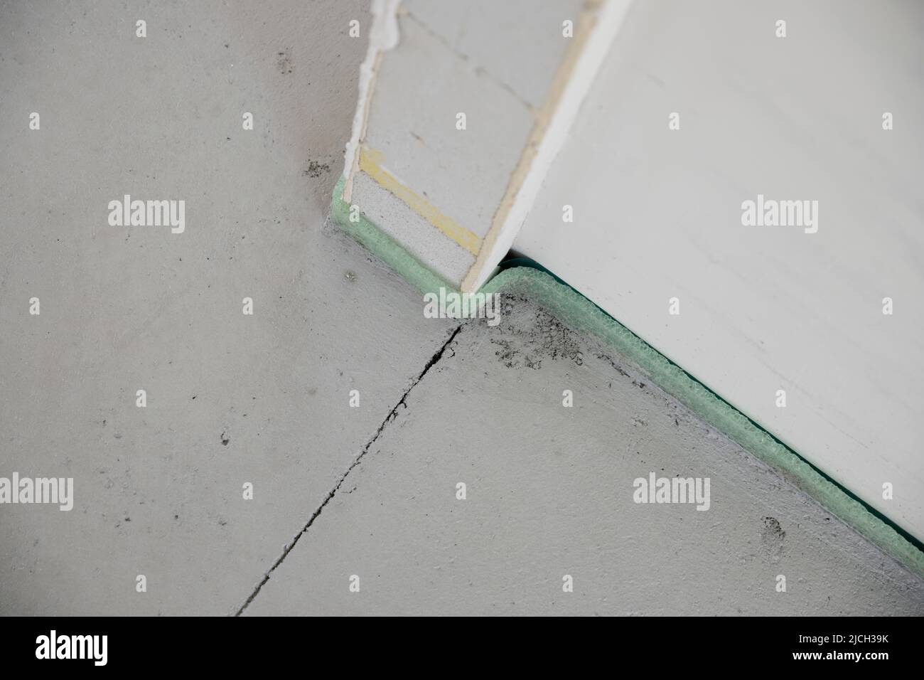 freshly cured concrete screed on construction site in loft in a family ...