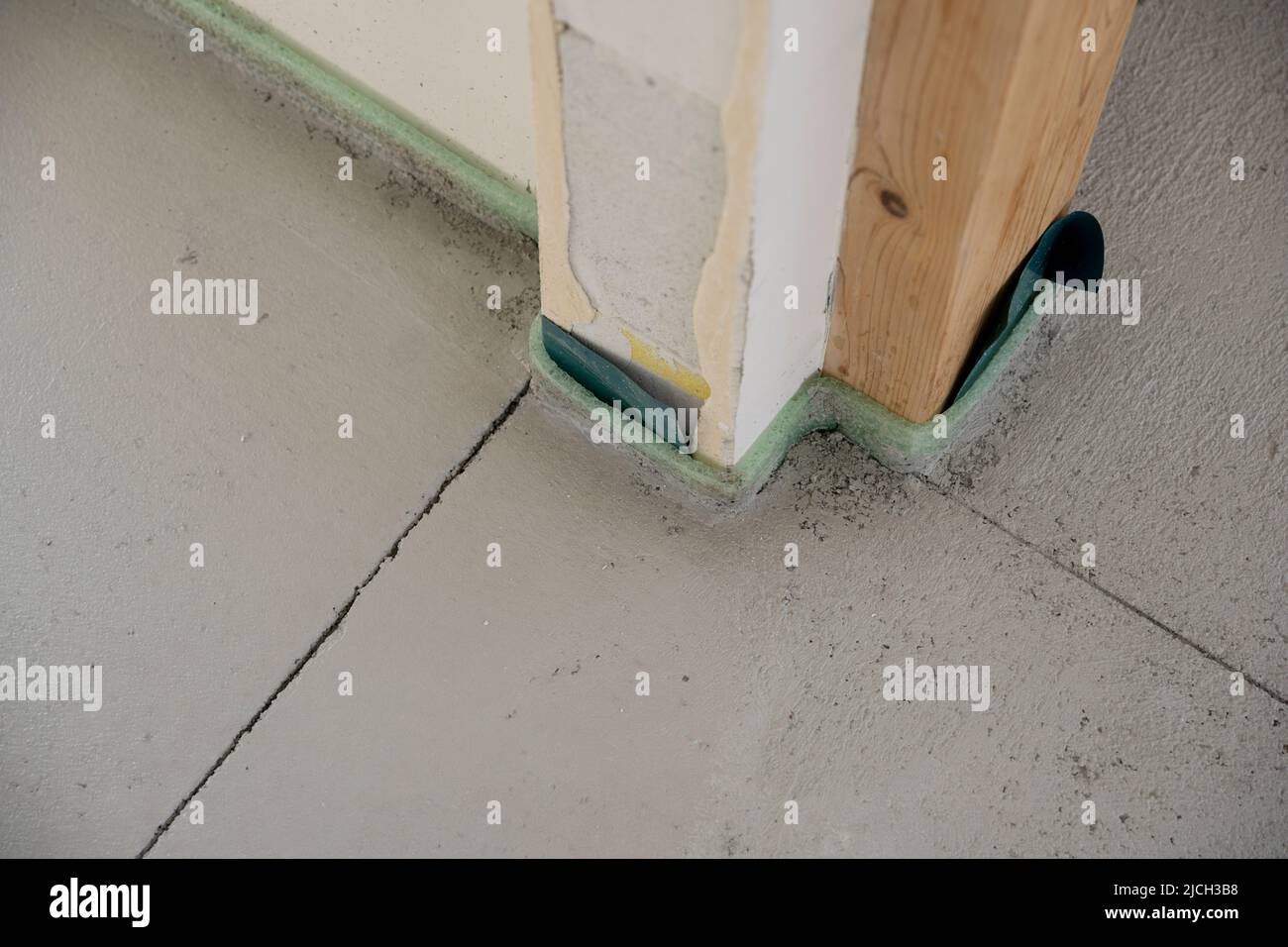 freshly cured concrete screed on construction site in loft in a family ...