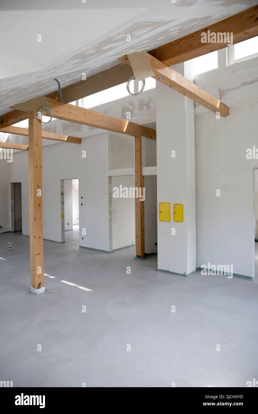 freshly cured concrete screed on construction site in loft in a family ...