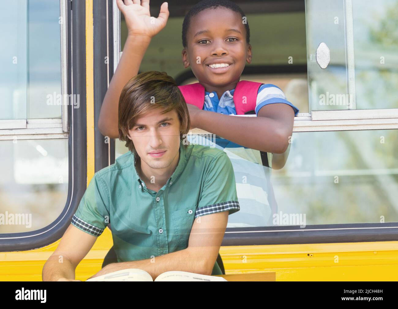 Composite image of caucasian boy against african american boy waving ...