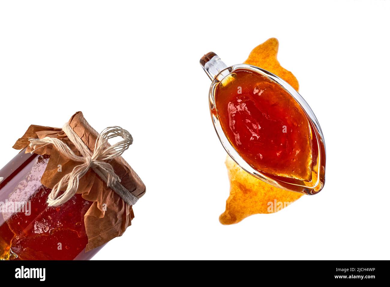 Orange color sweet fruit jam in glass bowl and jar isolated on white ...