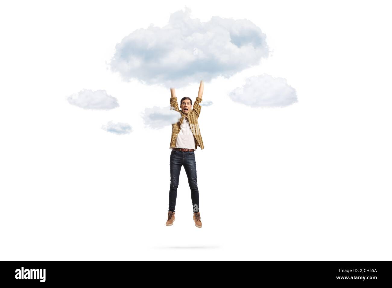 Scared young man hanging from clouds isolated on white background Stock ...