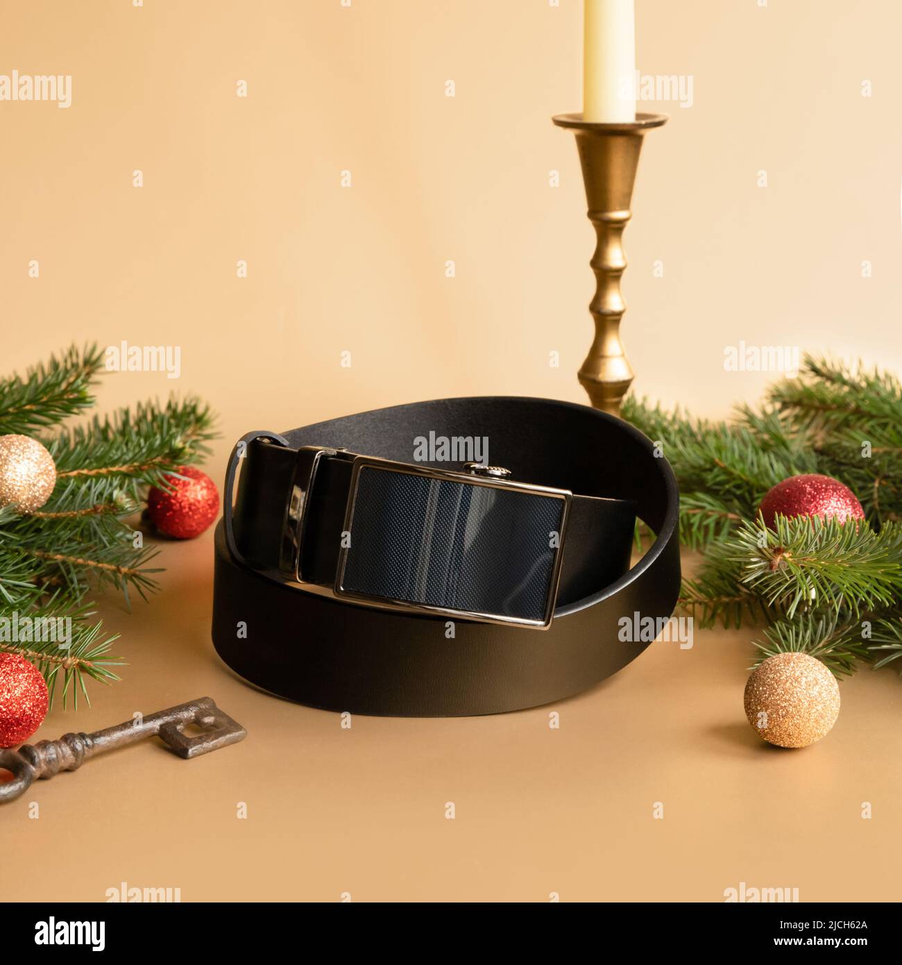 Rolled-up black fashionable men's leather belt with automatic buckle ...