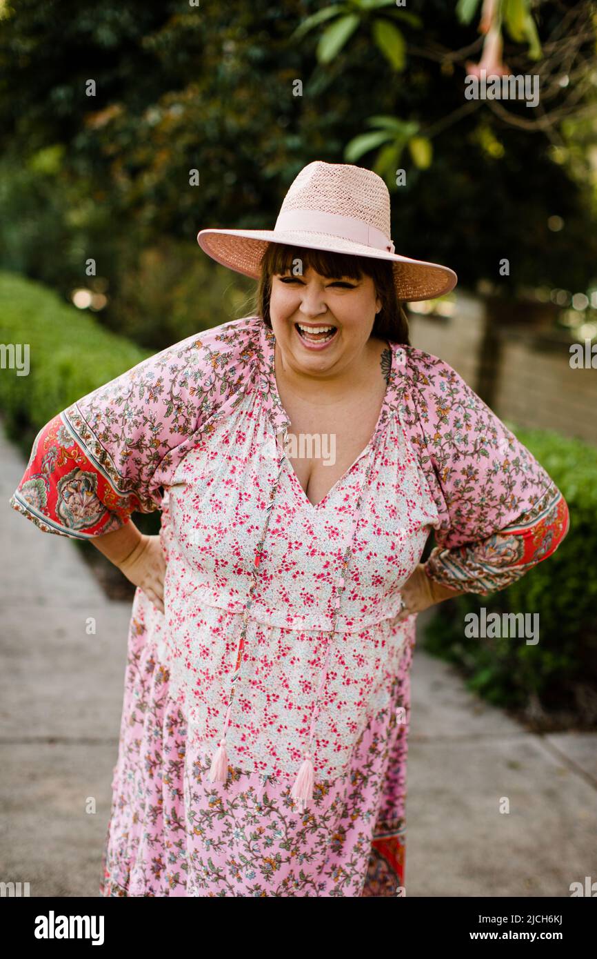 Plus Size Woman Modeling Dress & Hat in San Diego Stock Photo - Alamy