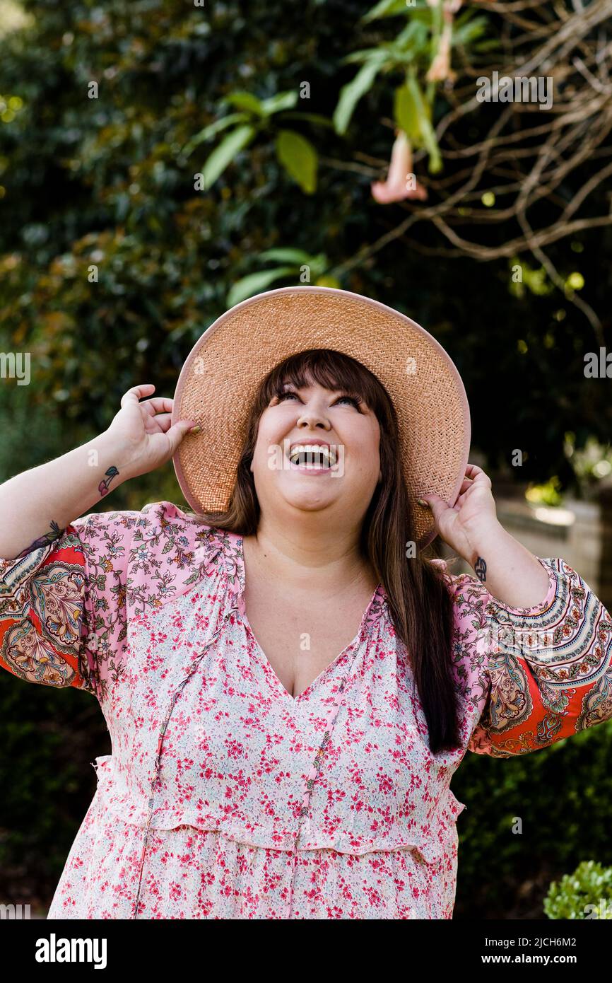 Plus Size Female Model Wearing Dress & Hat in San Diego Stock Photo - Alamy