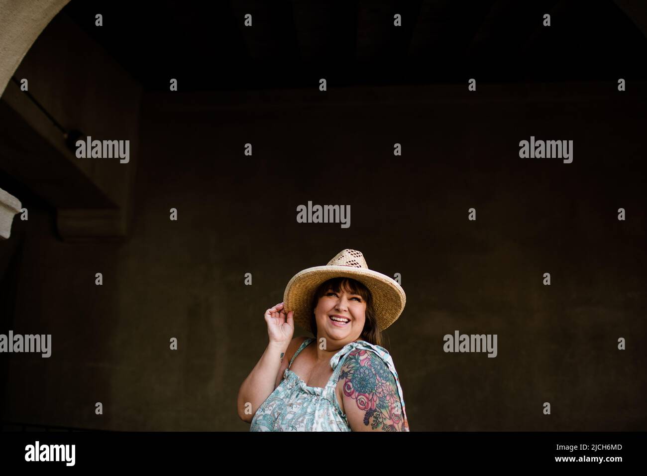 Plus Size Model Wearing Hat & Sleeveless Dress in San Diego Stock Photo ...