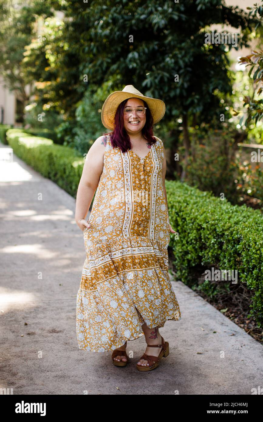 Size Inclusive Model Wearing Dress & Hat in San Diego Stock Photo - Alamy