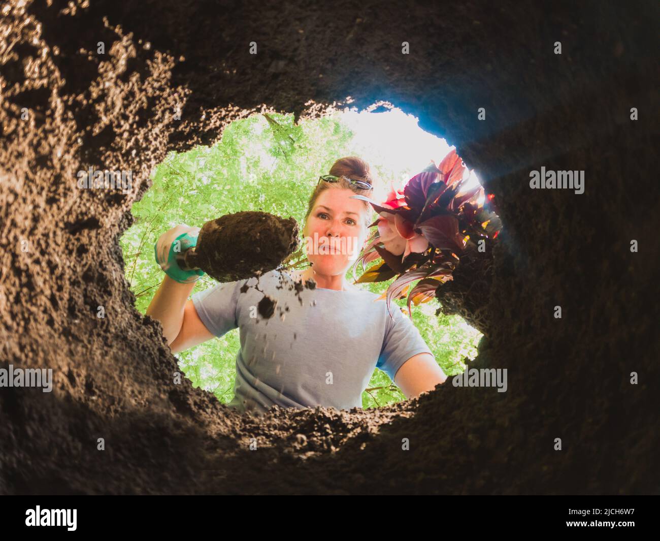 People Looking Down A Hole