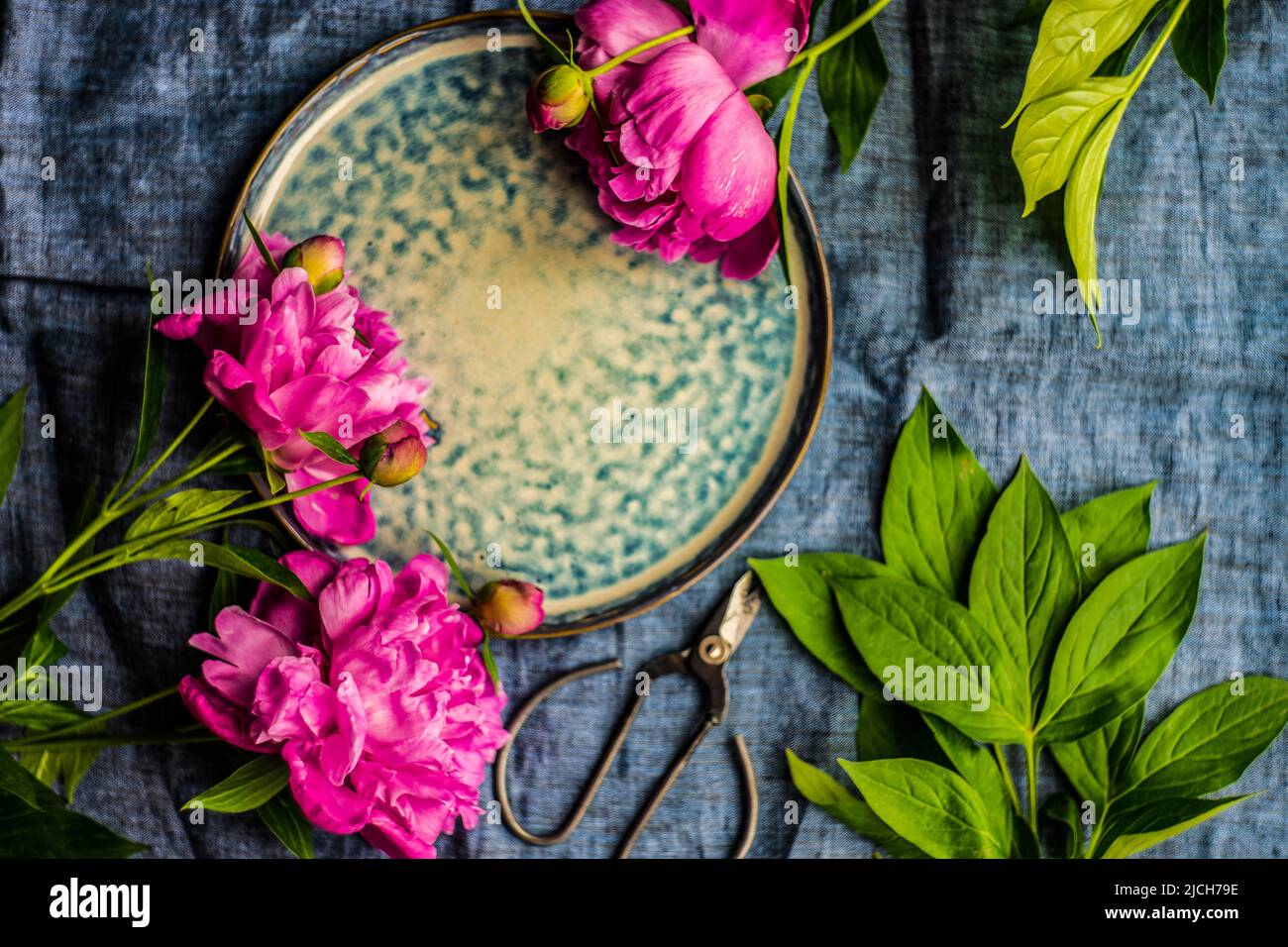 Summer dinner set with peonies Stock Photo - Alamy