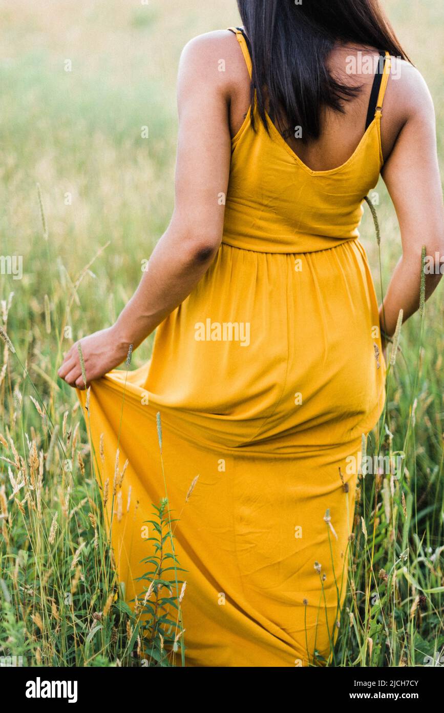 Woman standing rear view dress hi-res stock photography and images - Alamy