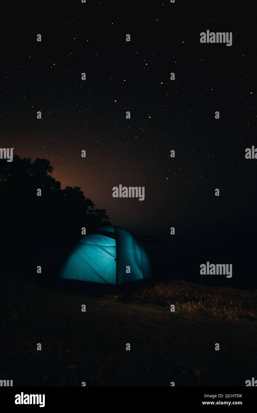 Camping Under the Stars on the Beach Stock Photo - Alamy