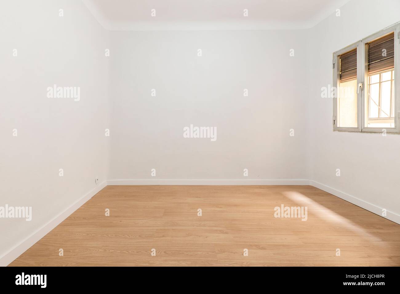 Empty room with aluminum window with shutter half up, wooden ...