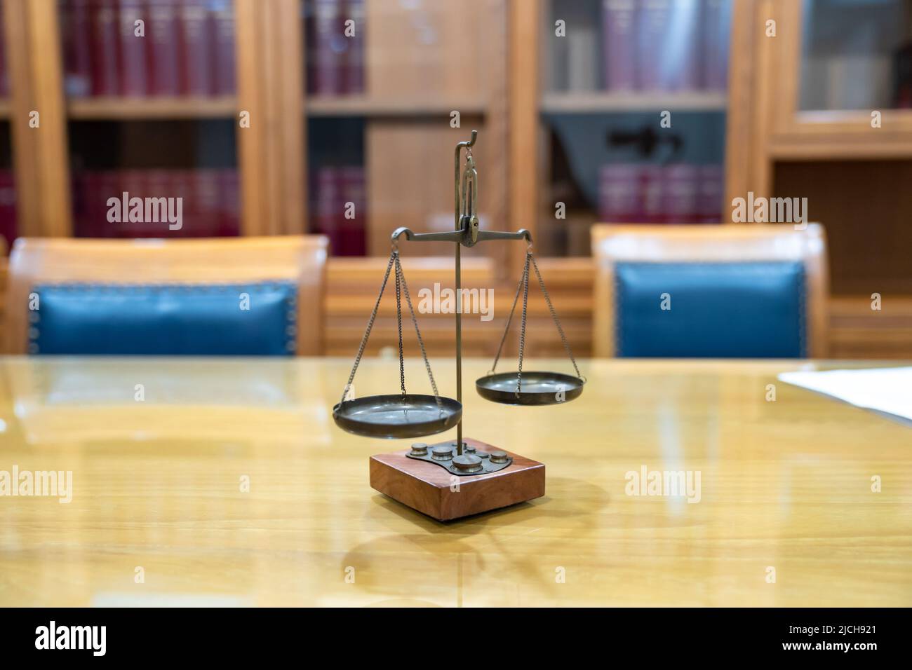Old Brass Law Scale vintage style is laid on wood glass table in Lawyer ...