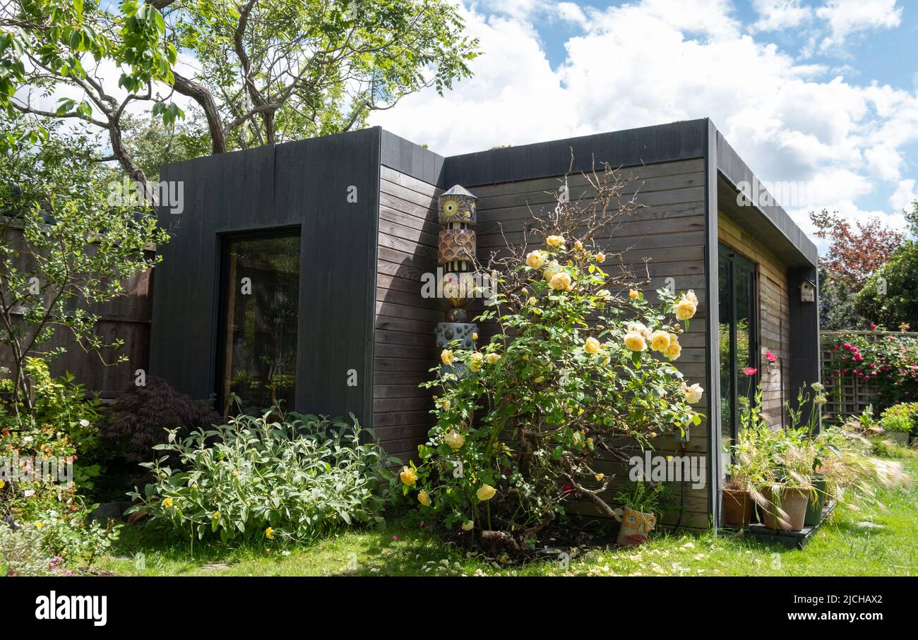 Neglected, untidy, messy, overgrown, secluded cottage garden with ...