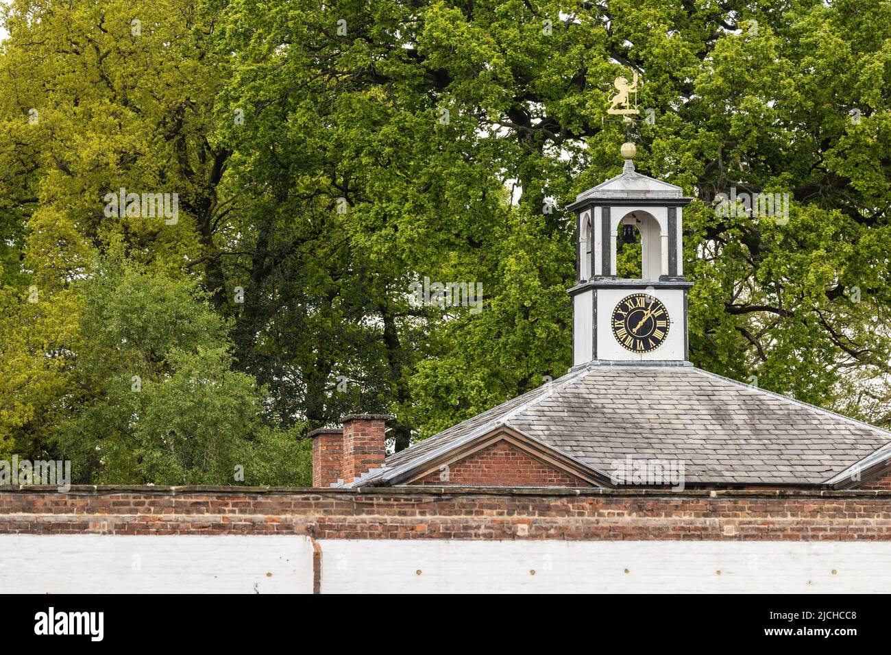 small clock tower on a old farm building Stock Photo - Alamy
