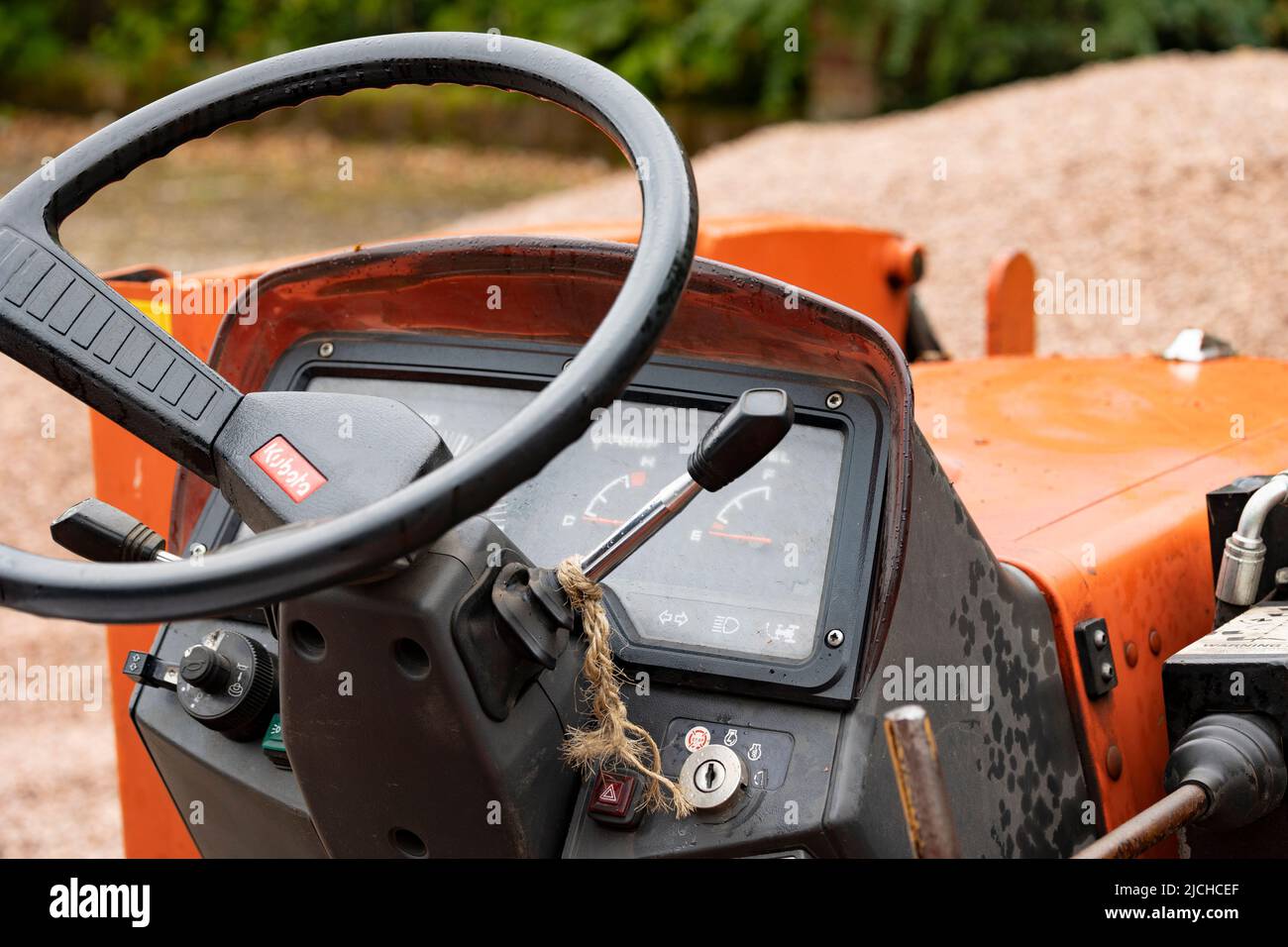 views of a orange mini tractor Stock Photo - Alamy