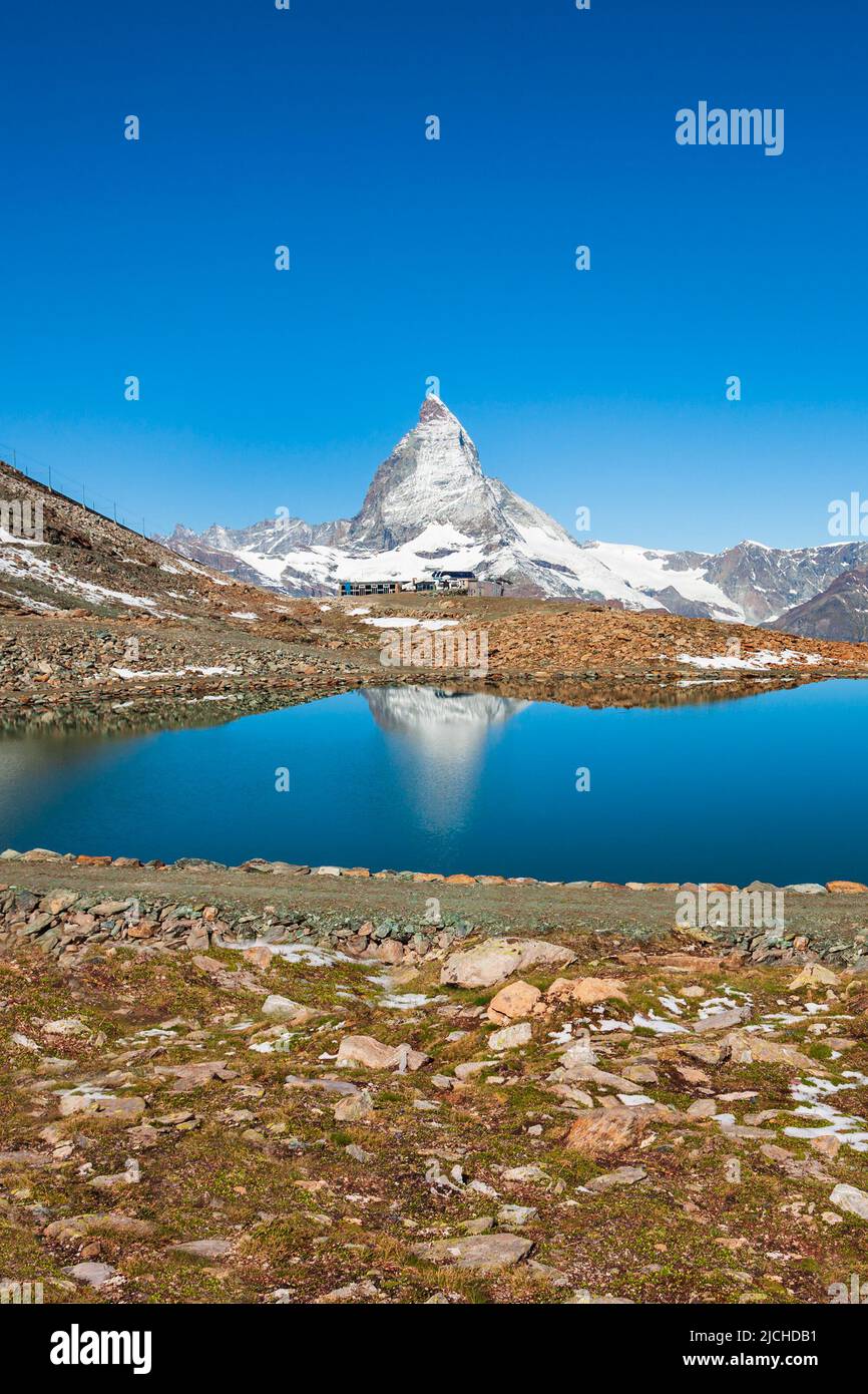 Riffelsee lake and Matterhorn mountain in the Alps, located between ...