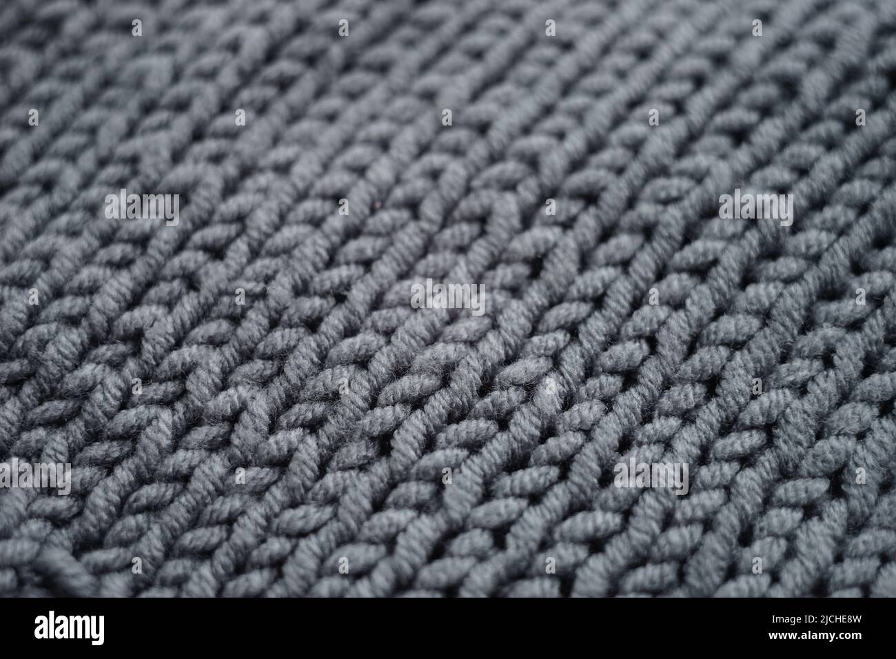 Knitted grey background, gray sweater pattern Stock Photo - Alamy