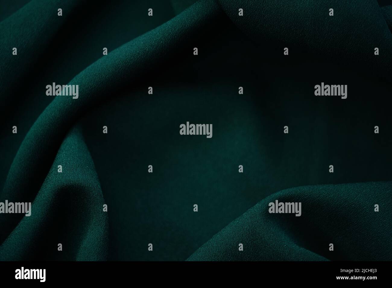 Delicate dark green thin fabric, emerald material chiffon Stock Photo ...