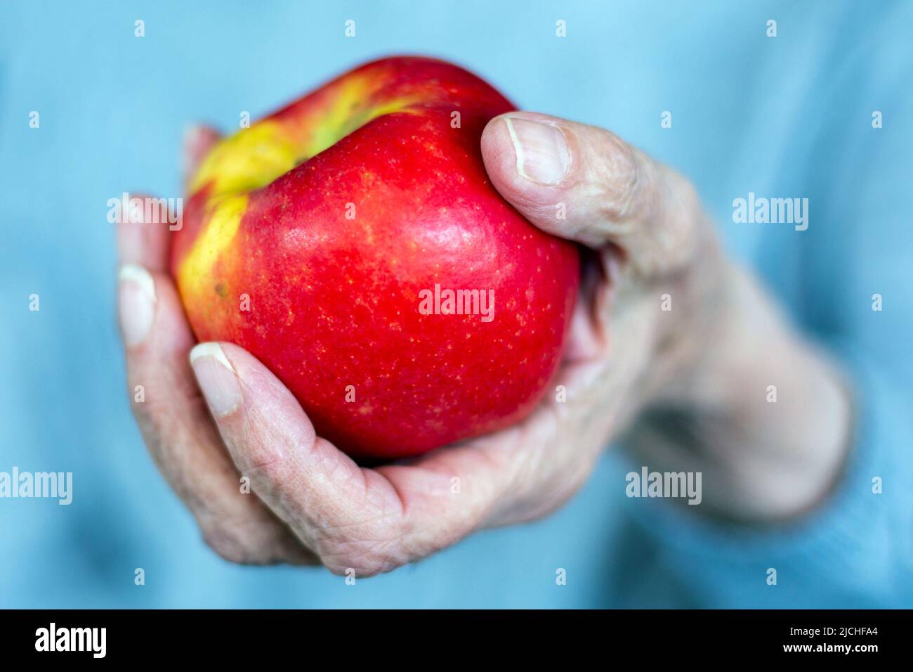 Old lady eating apple hi-res stock photography and images - Alamy