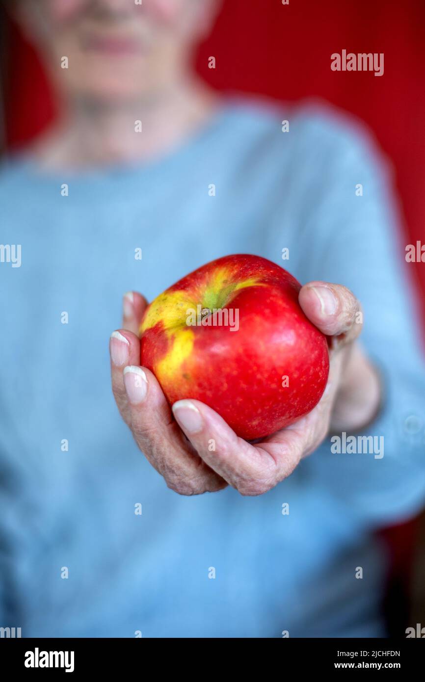 Old lady eating apple hi-res stock photography and images - Alamy