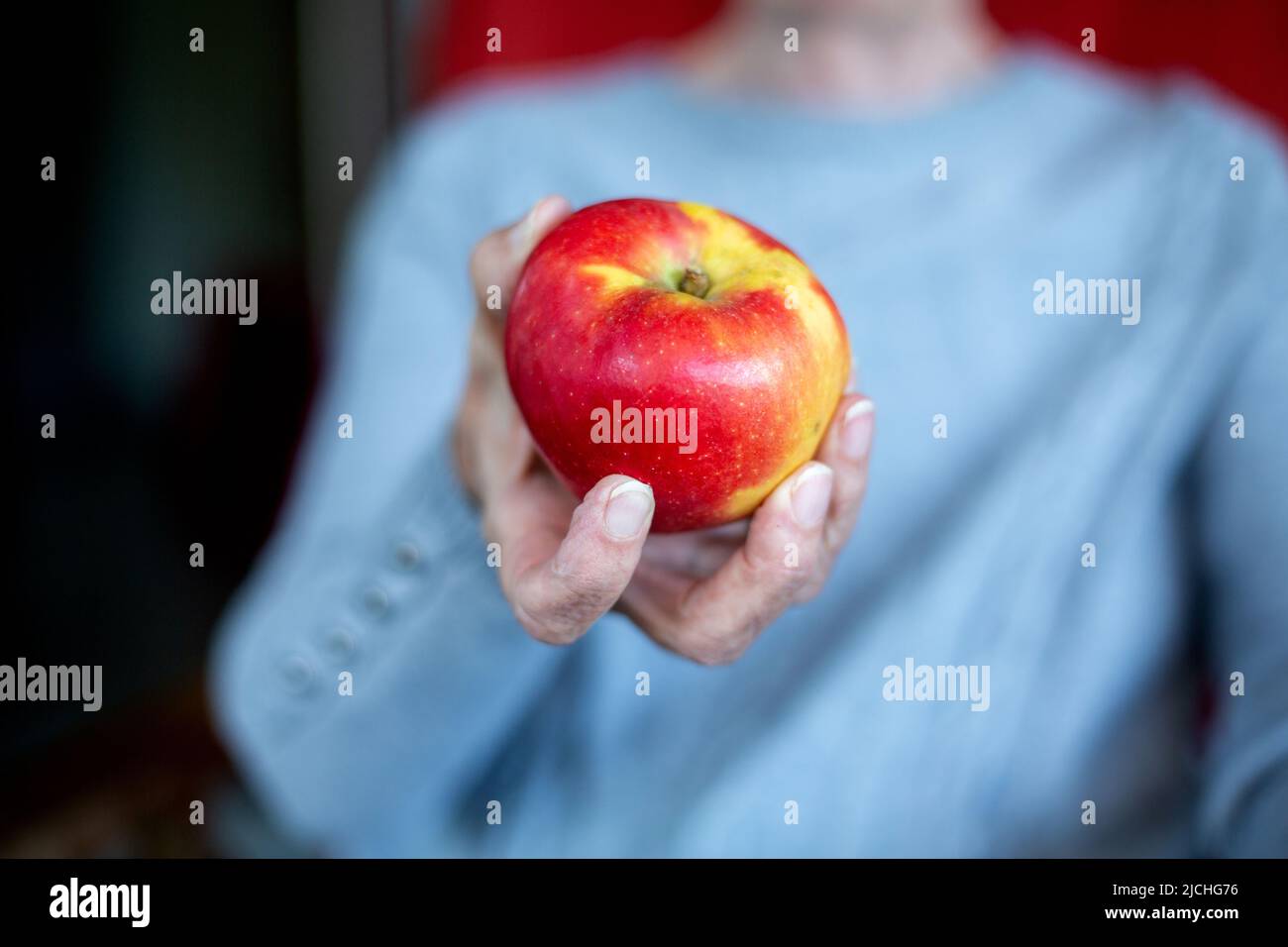 Old lady eating apple hi-res stock photography and images - Alamy