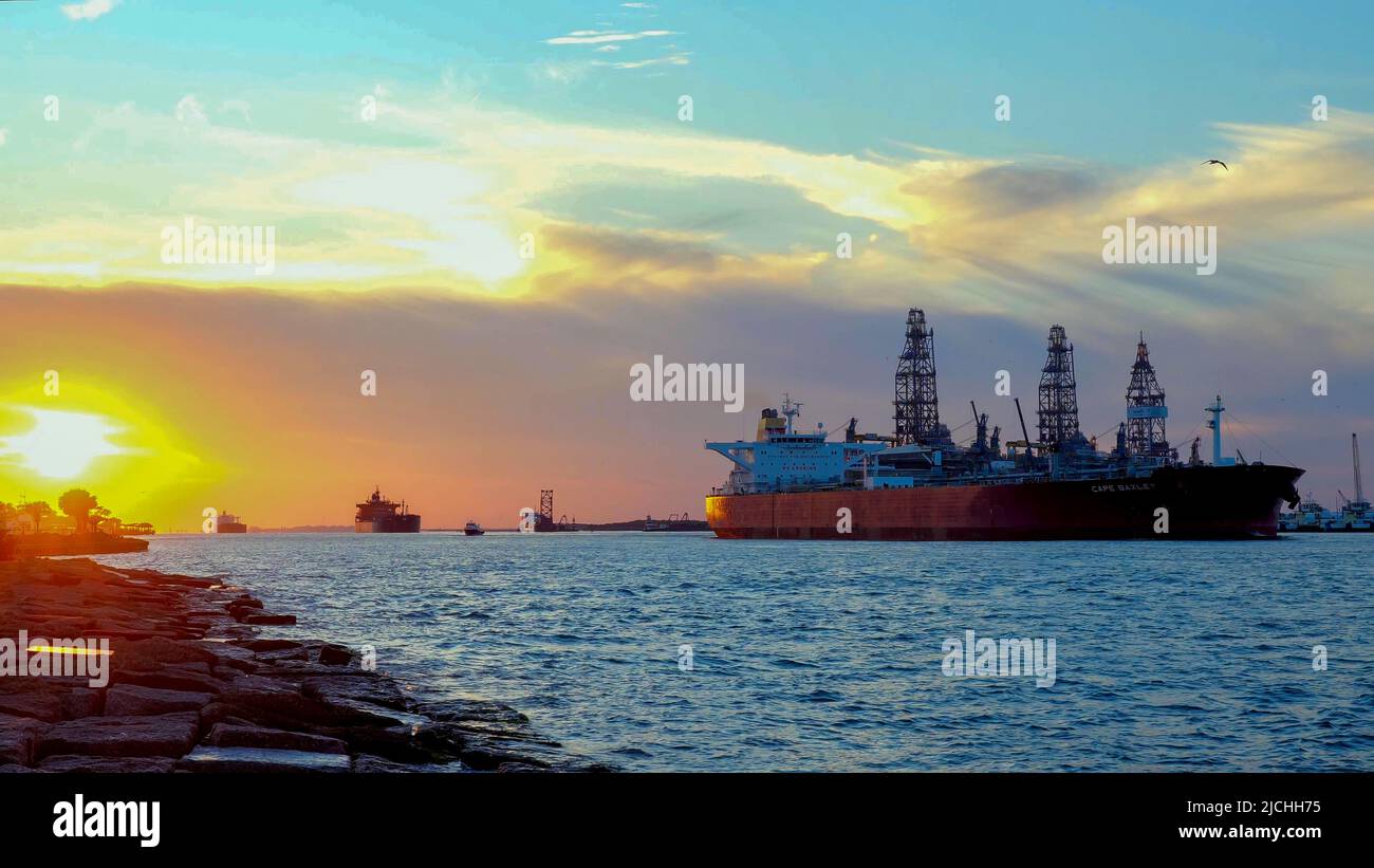 PORT ARANSAS, TX - 21 FEB 2020: Beautiful sunset with three oil tanker ...