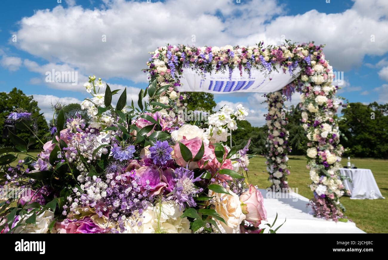 Jewish couple at marriage ceremony under chuppa wedding canopy. Canopy ...
