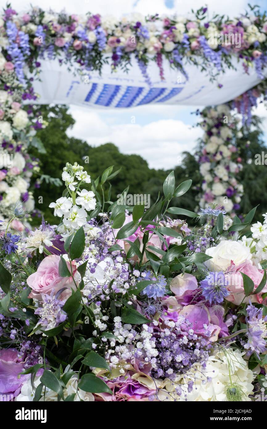 Jewish couple at marriage ceremony under chuppa wedding canopy. Canopy ...