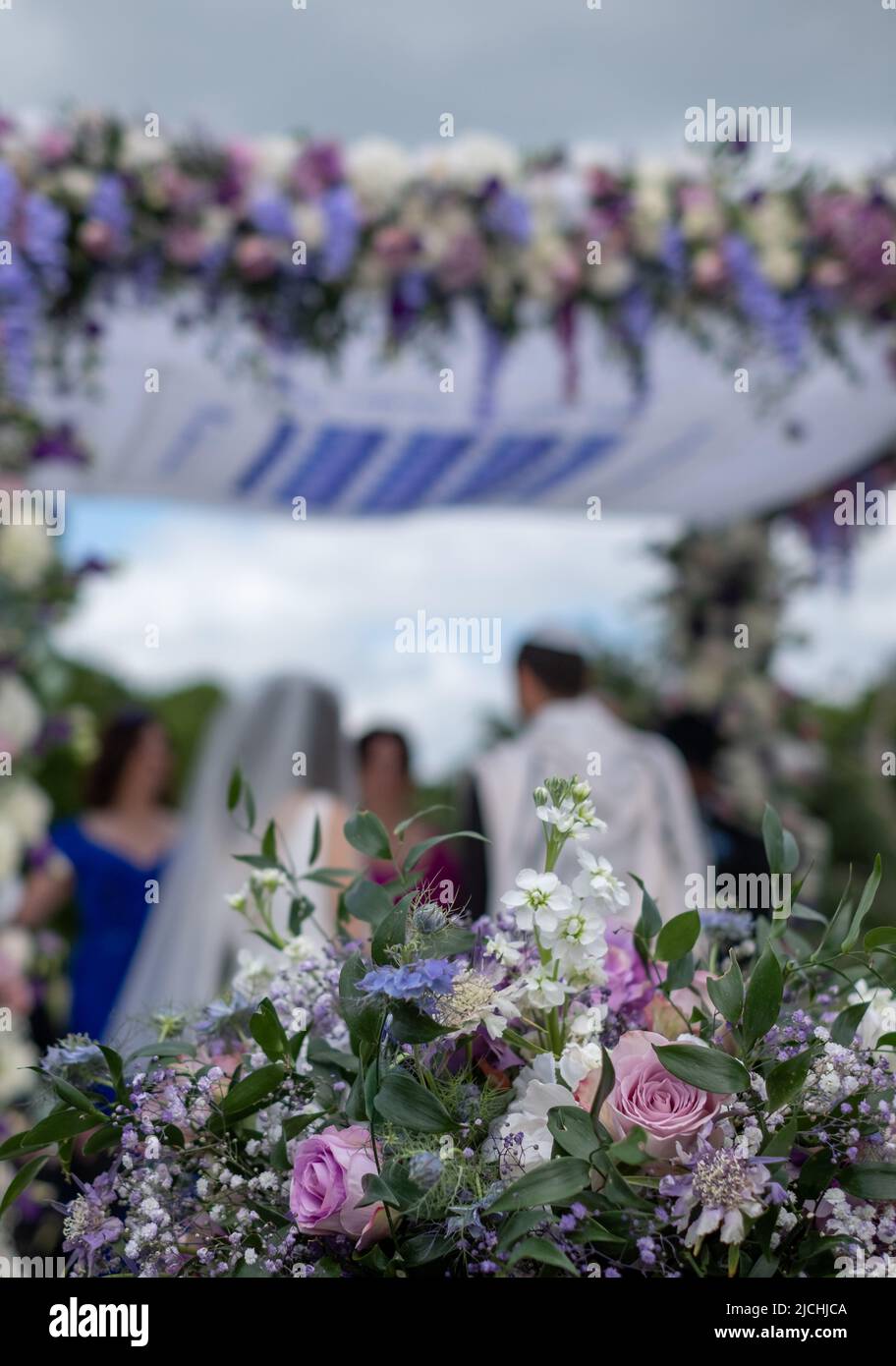 Jewish couple at marriage ceremony under chuppa wedding canopy. Canopy ...