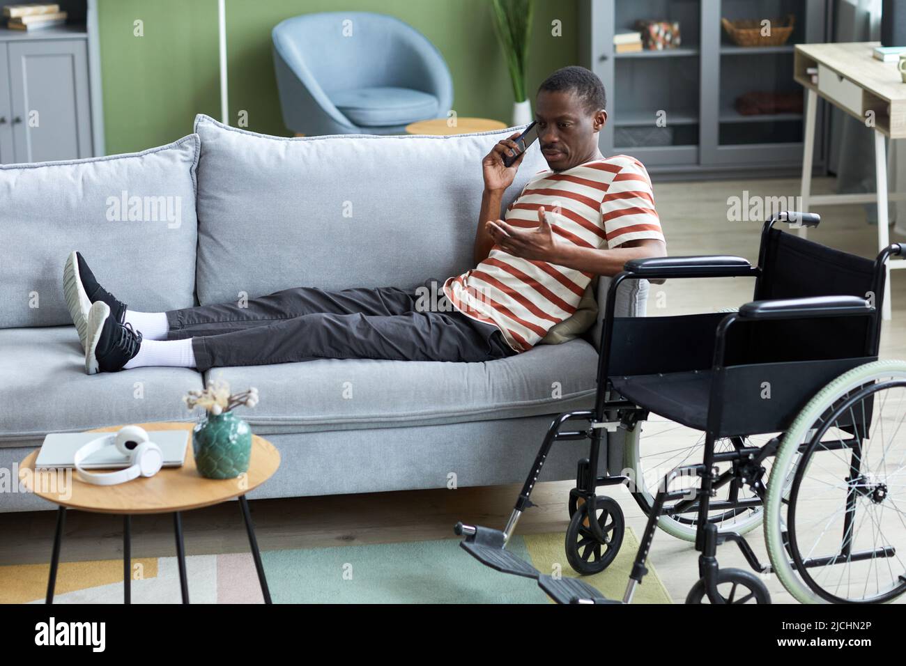Side view portrait of African American man with disability speaking on ...