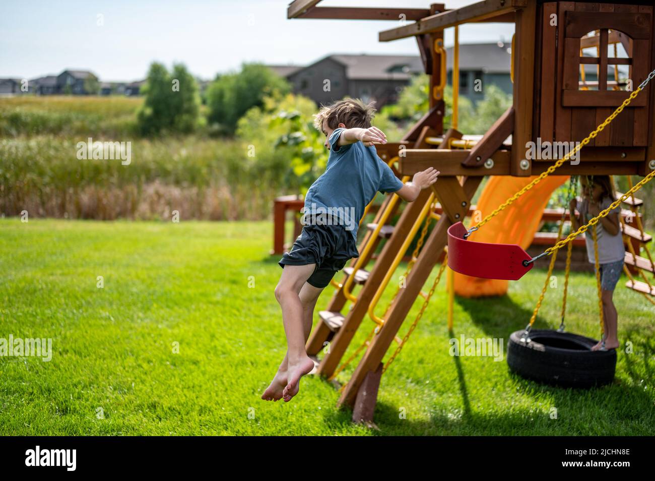 Swing set backyard hi-res stock photography and images - Alamy