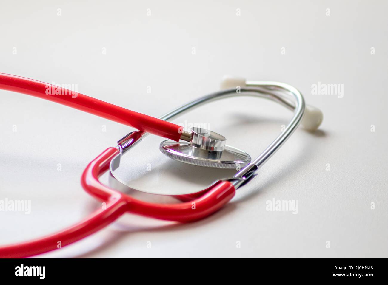 Red stethoscope in doctors office for professional cardio checkup and ...